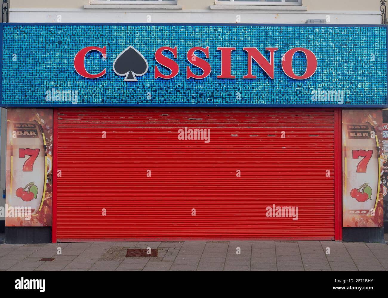 Casino sign seen above a closed shop front Stock Photo - Alamy