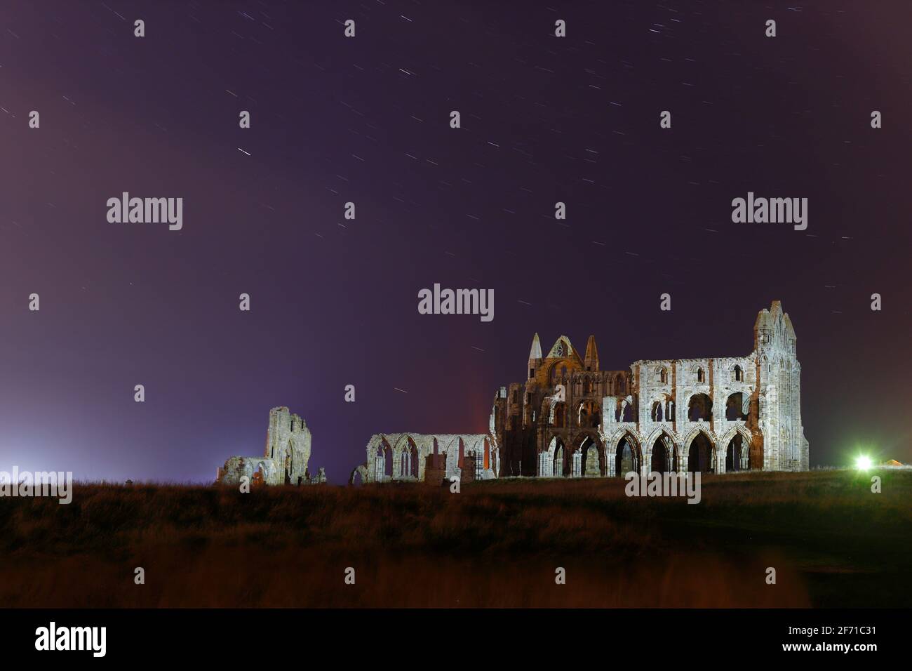 Whitby Abbey at night, illuminated by torch light Stock Photo - Alamy