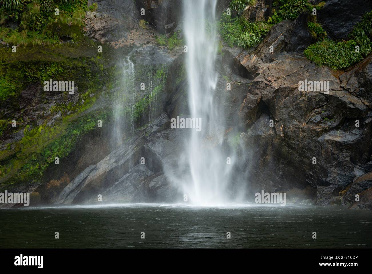 Thundering waterfalls in Milford Sound, New Zealand Stock Photo - Alamy
