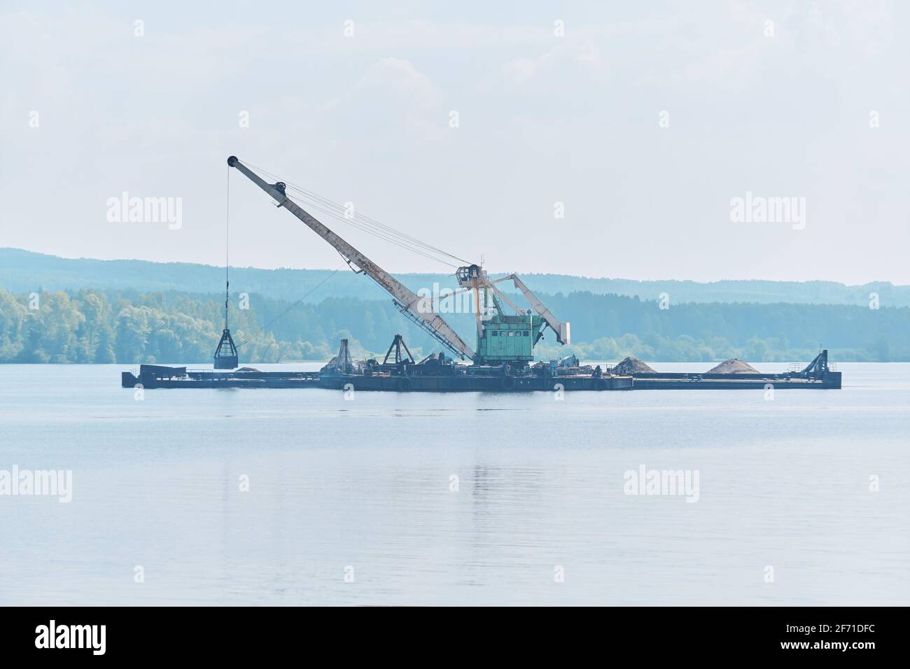 dredger is working to deepen the fairway on the river Stock Photo - Alamy