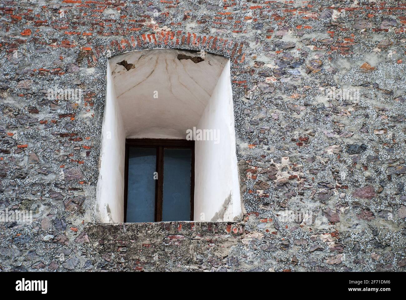 ancient windows in a stone wall Stock Photo - Alamy