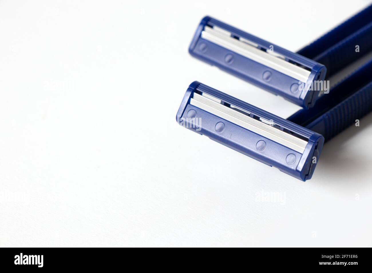 The disposable razor on white Stock Photo - Alamy