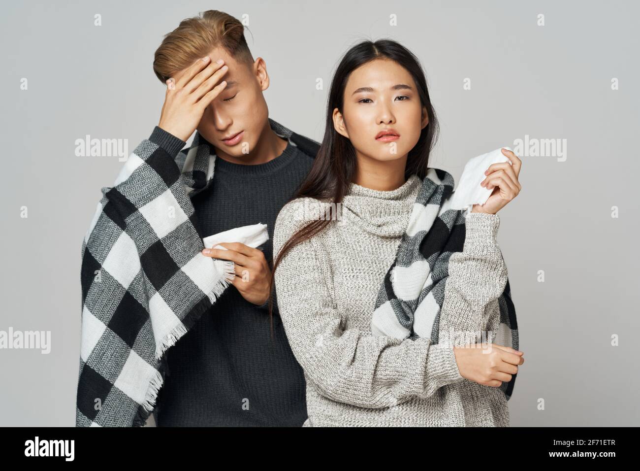 man with a plaid on his shoulders and a woman in a sweater health ...