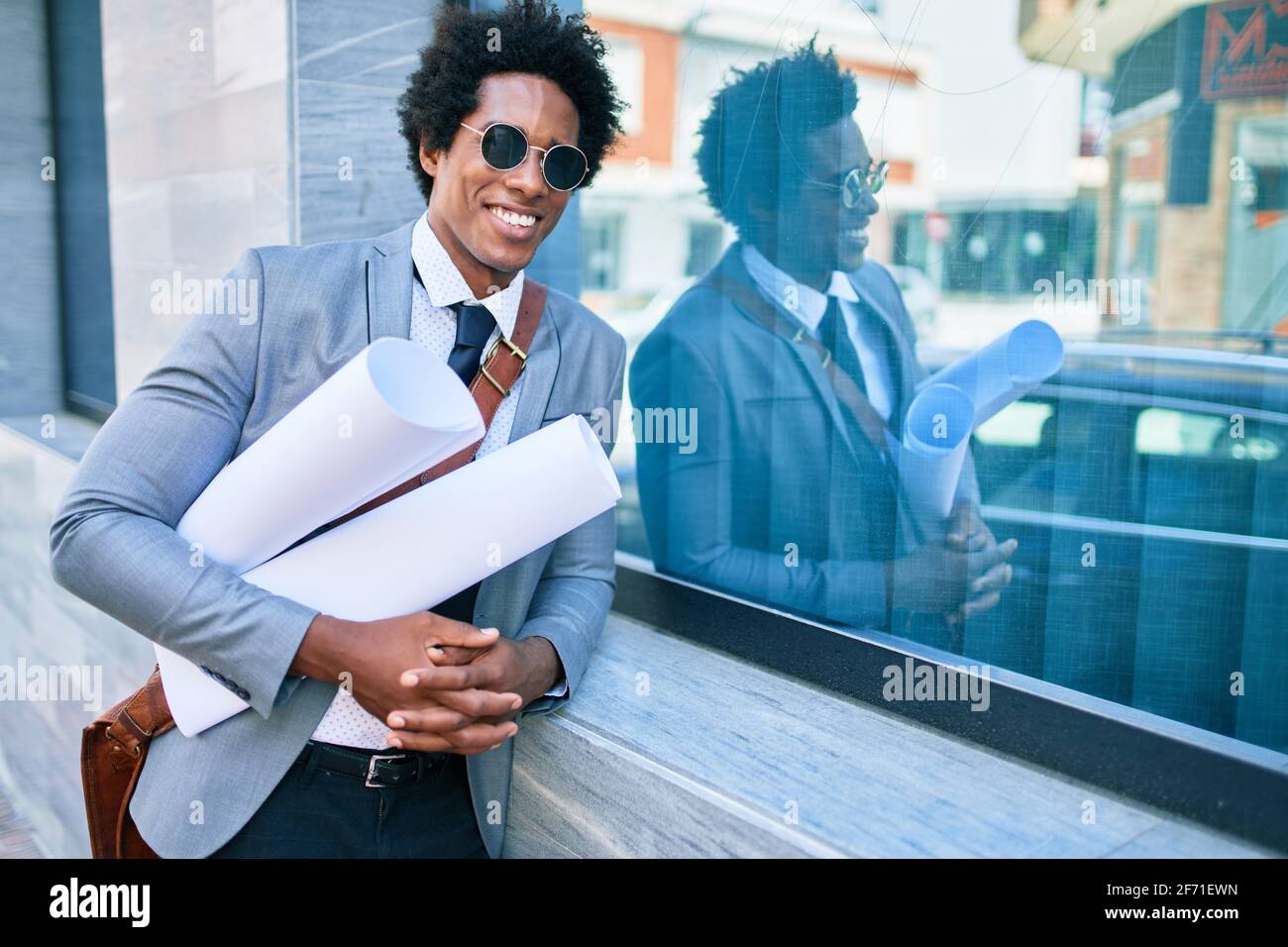 Young handsome african american architect man smiling happy. Leaning on ...