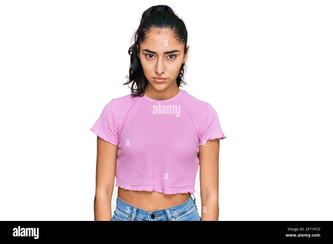 Hispanic teenager girl with dental braces wearing casual clothes ...