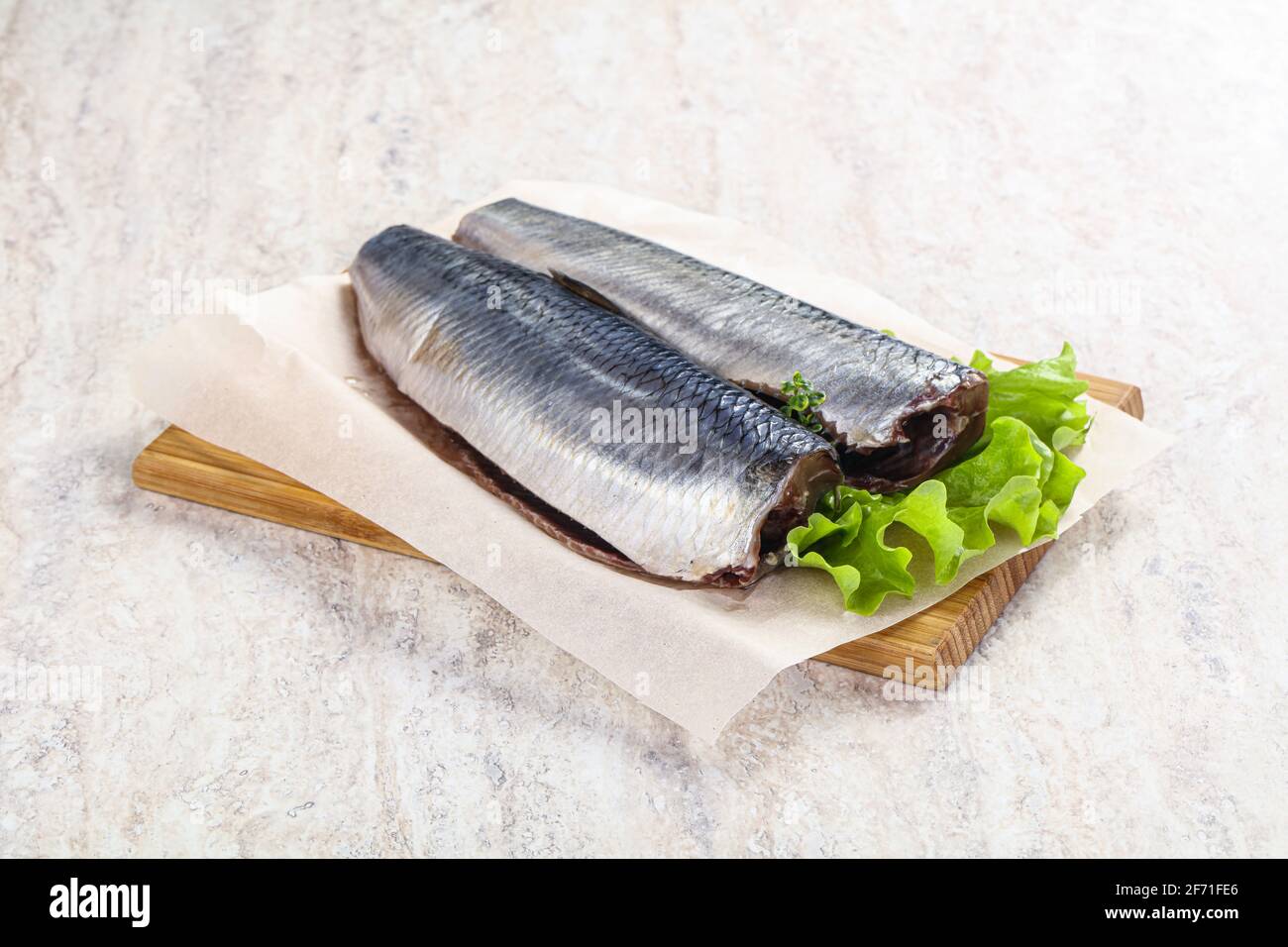 Marinated Herring fillet with skin for cooking Stock Photo - Alamy