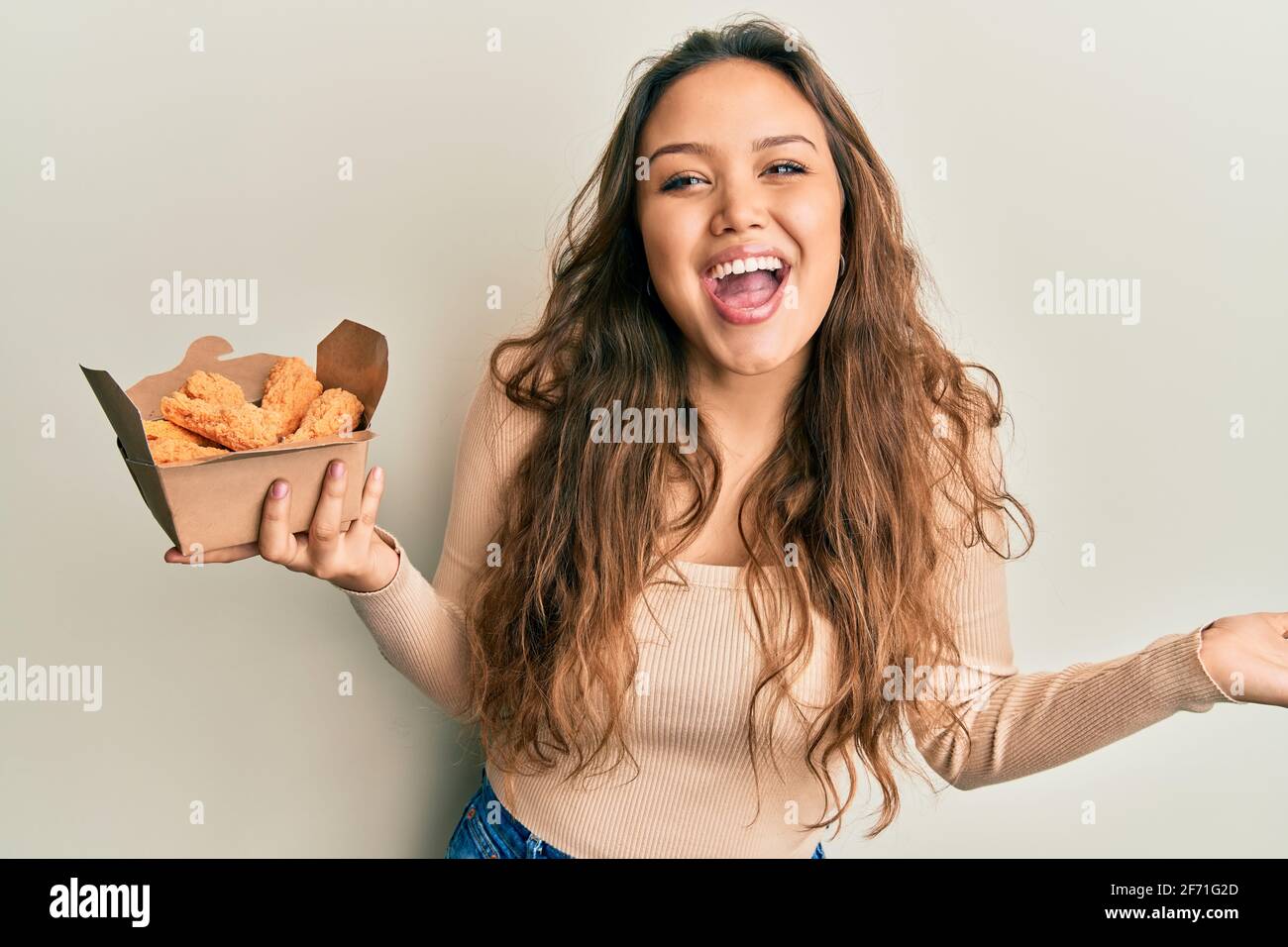 Buffalo wings eating hands hi-res stock photography and images - Alamy