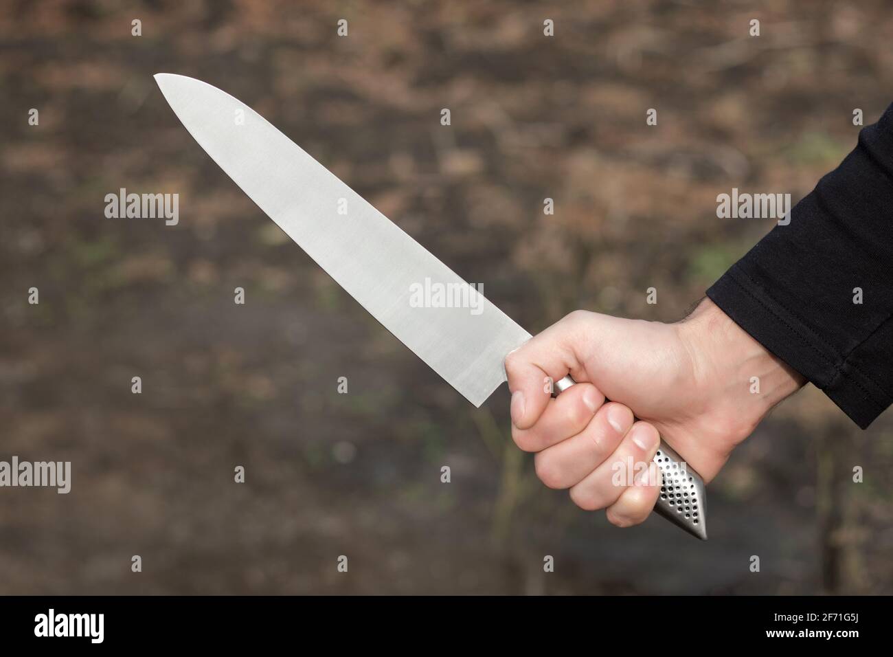 The man with a knife in a hand. Closeup Stock Photo - Alamy