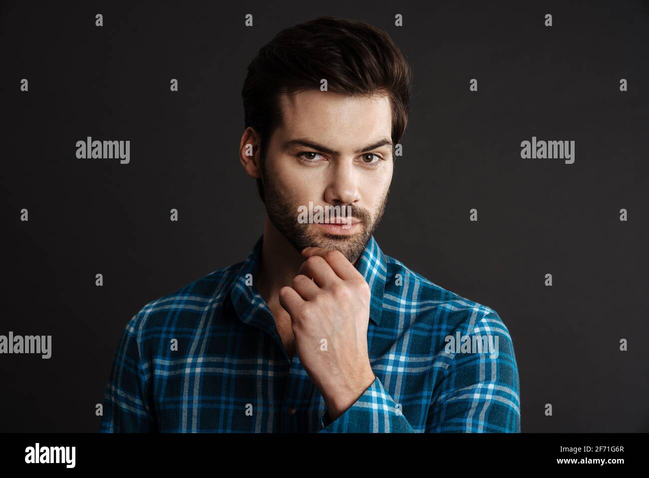Confident handsome unshaven guy hi-res stock photography and images - Alamy