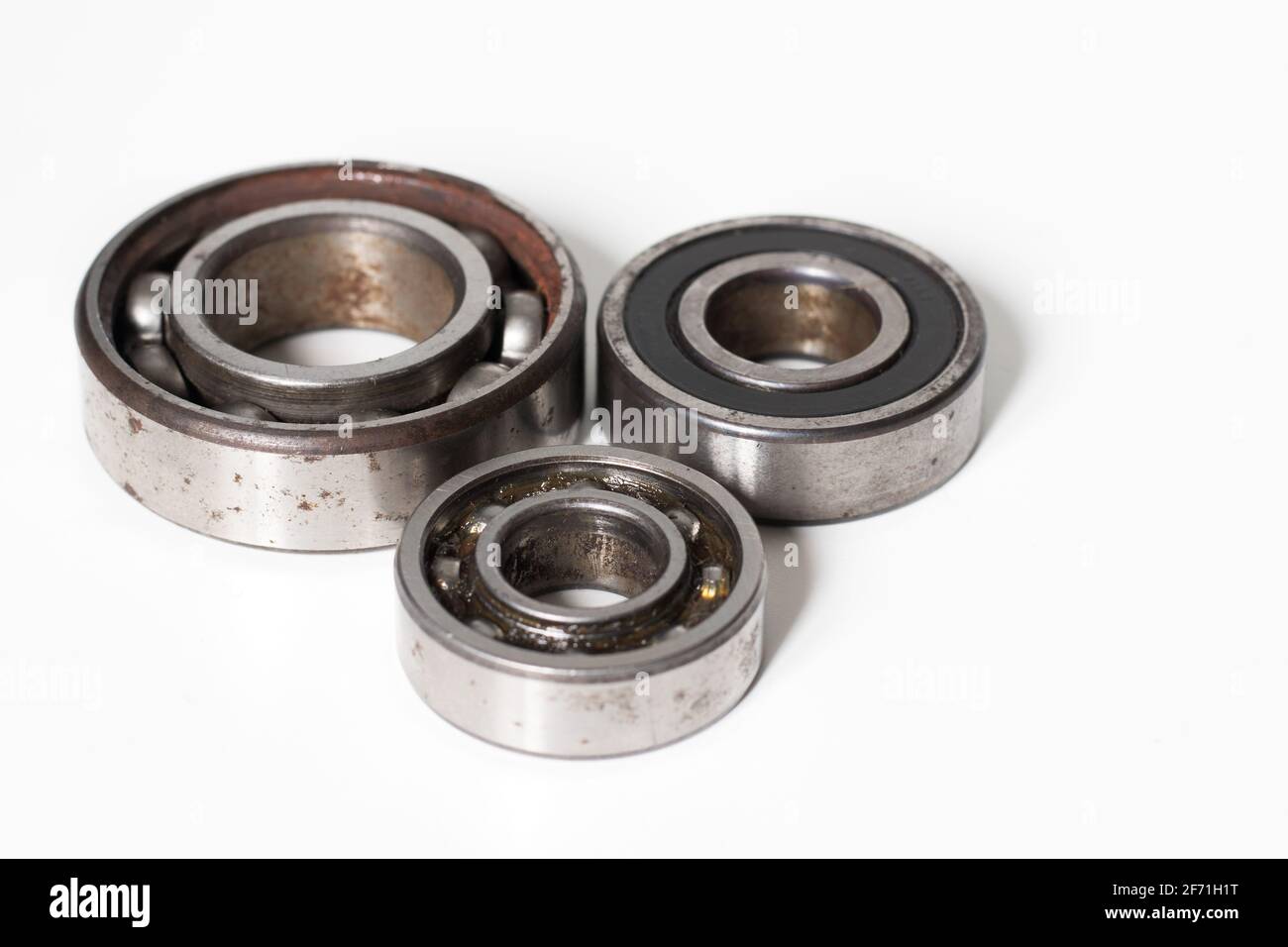Three close-up bearings on the white background Stock Photo - Alamy