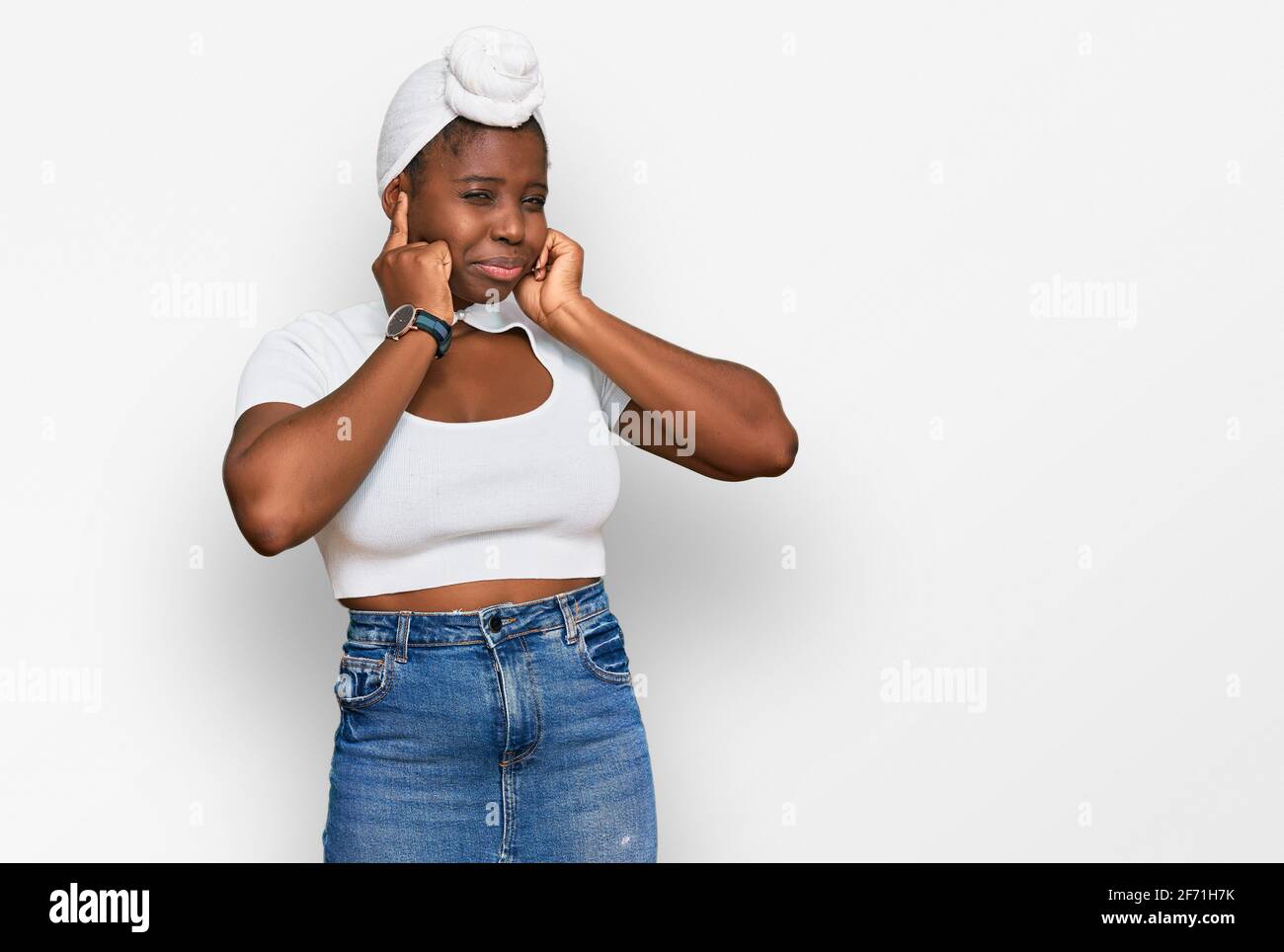 Young african woman with turban wearing hair turban over isolated ...