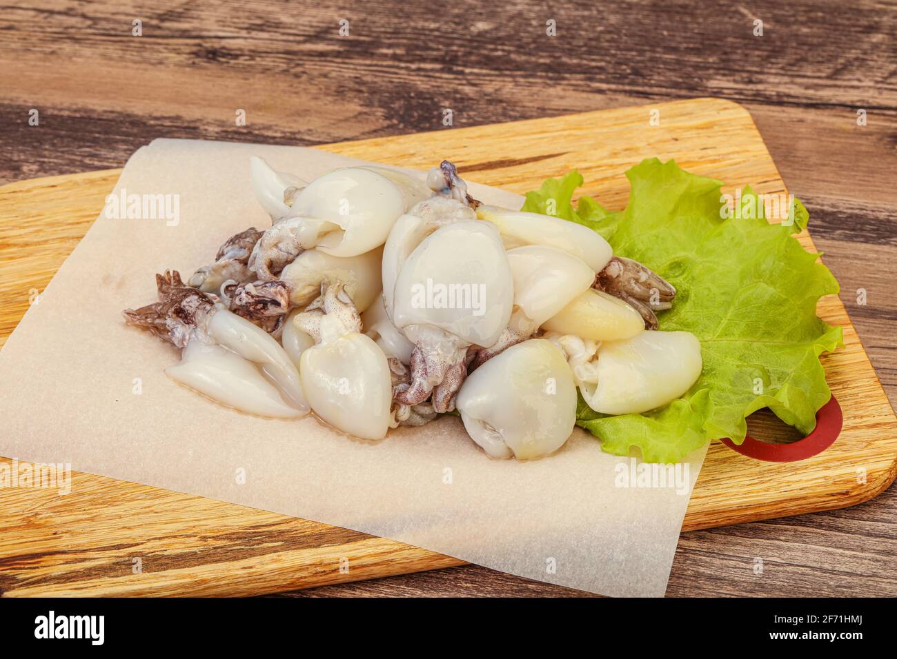 Raw seafood - cuttlefish for cooking over board Stock Photo - Alamy
