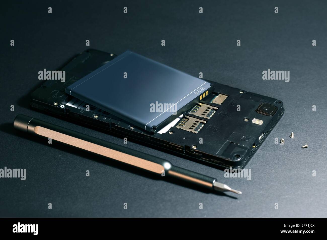 Repair smartphone, disassembled phone with a screwdriver Stock Photo ...