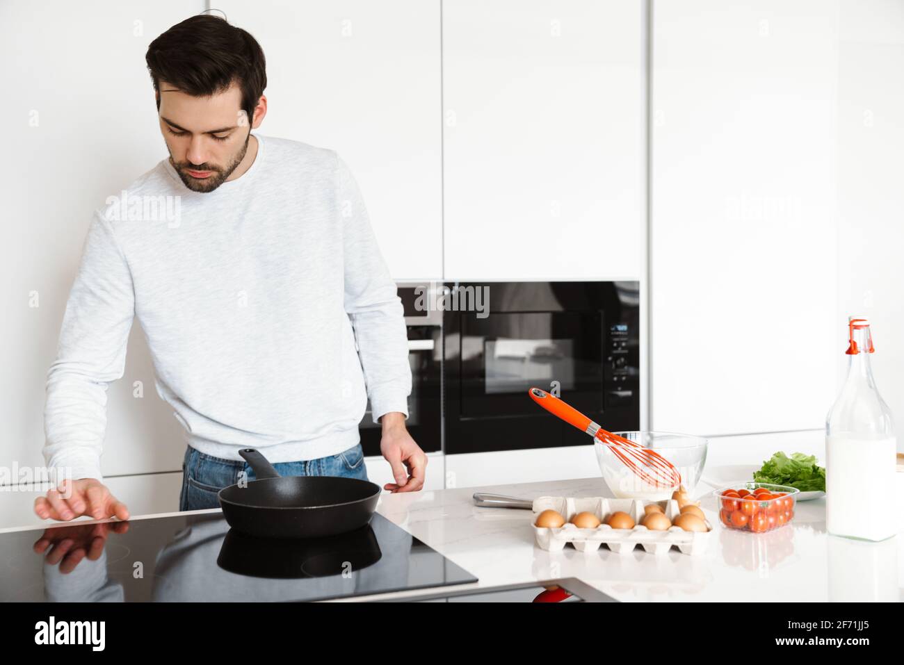 Man cooking scrambled eggs hi-res stock photography and images - Alamy
