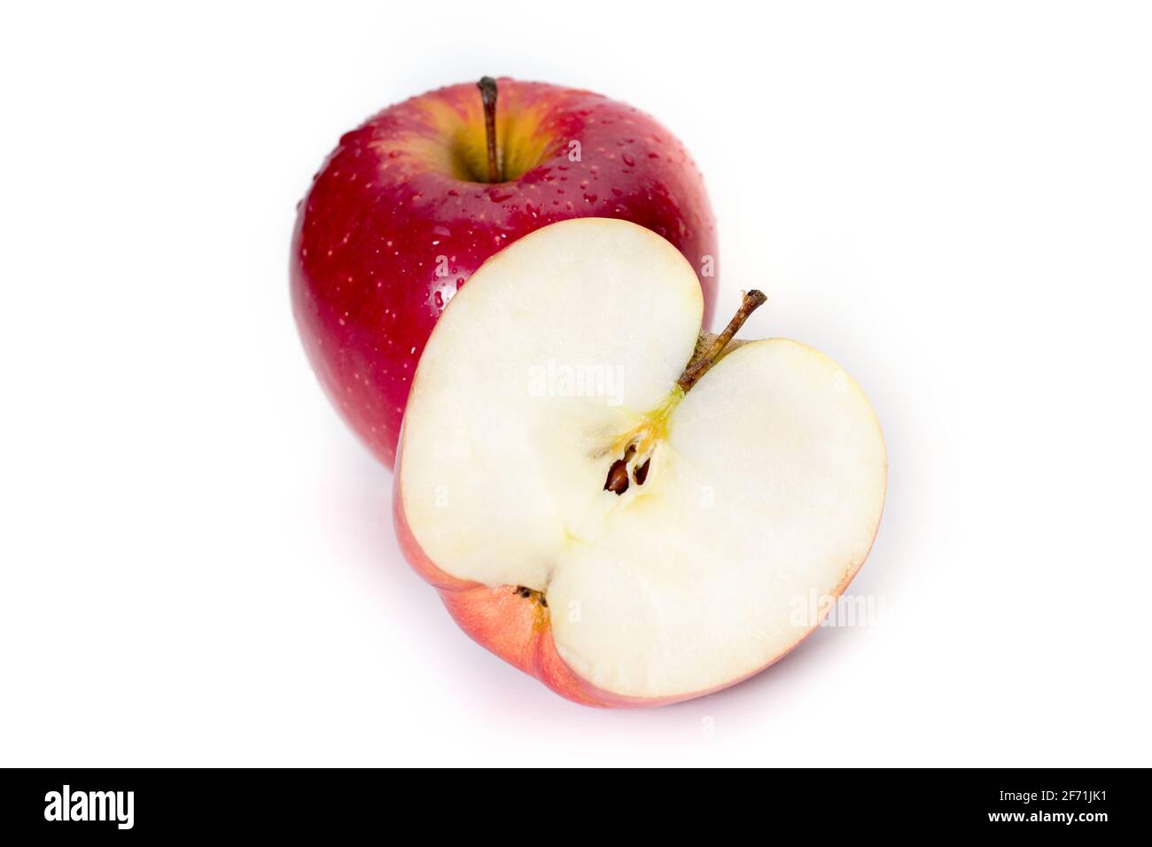 Cut red apple fruits isolated on white background Stock Photo - Alamy