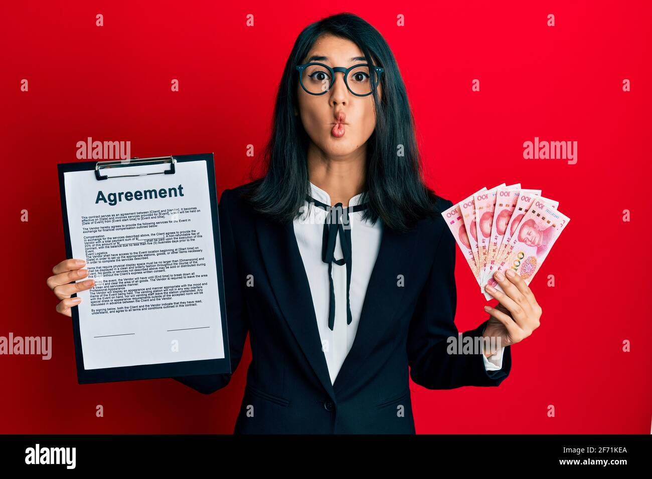 Beautiful asian young business woman holding agreement document and 100 ...