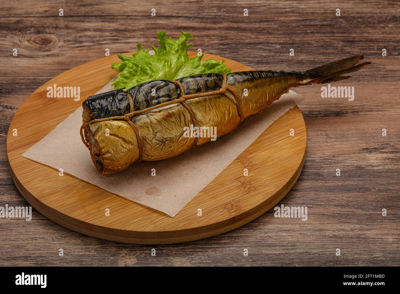 Smoked tasty mackerel fish snack over board Stock Photo - Alamy