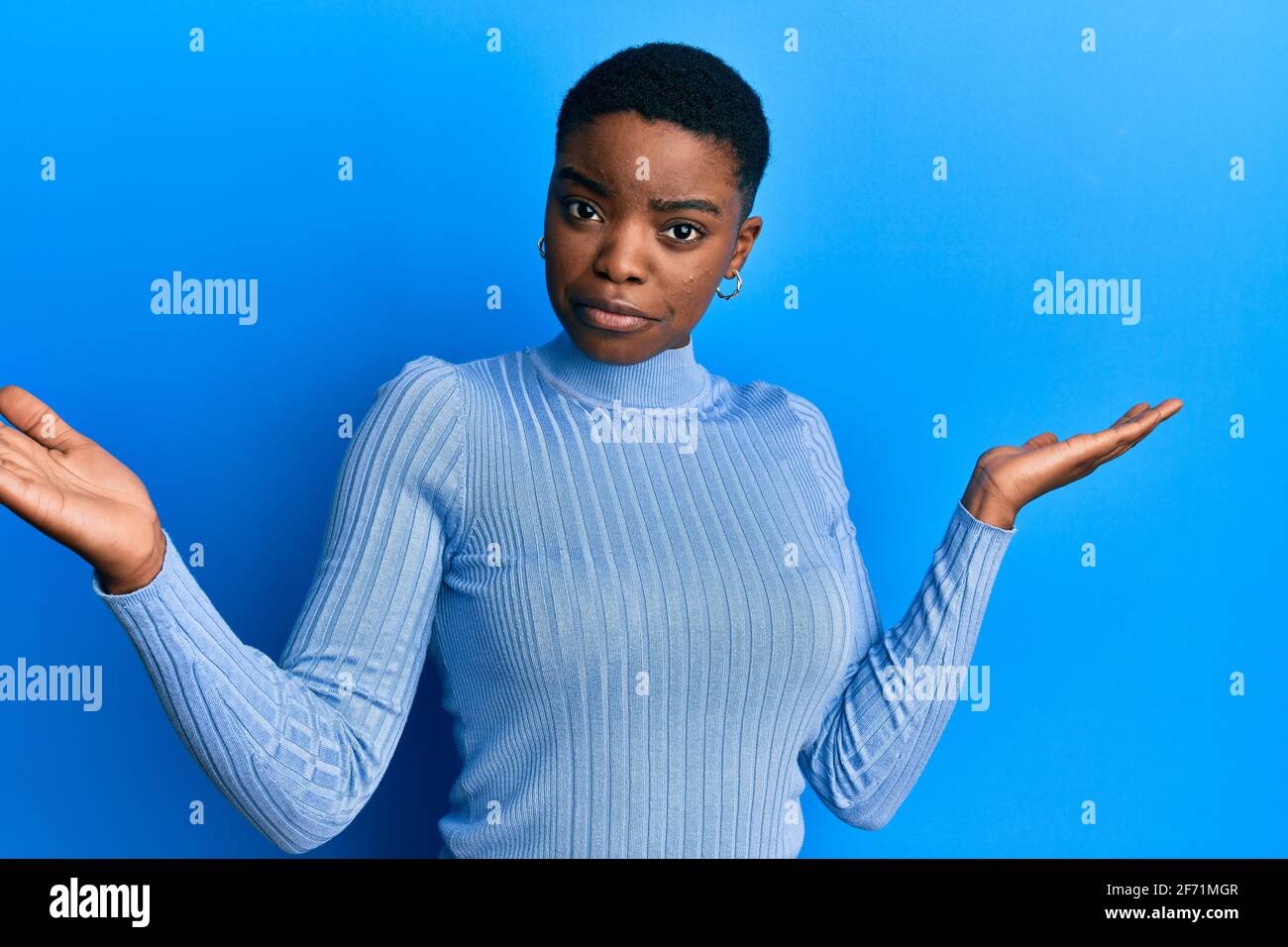 Young African American Woman Wearing Casual Clothes Clueless And