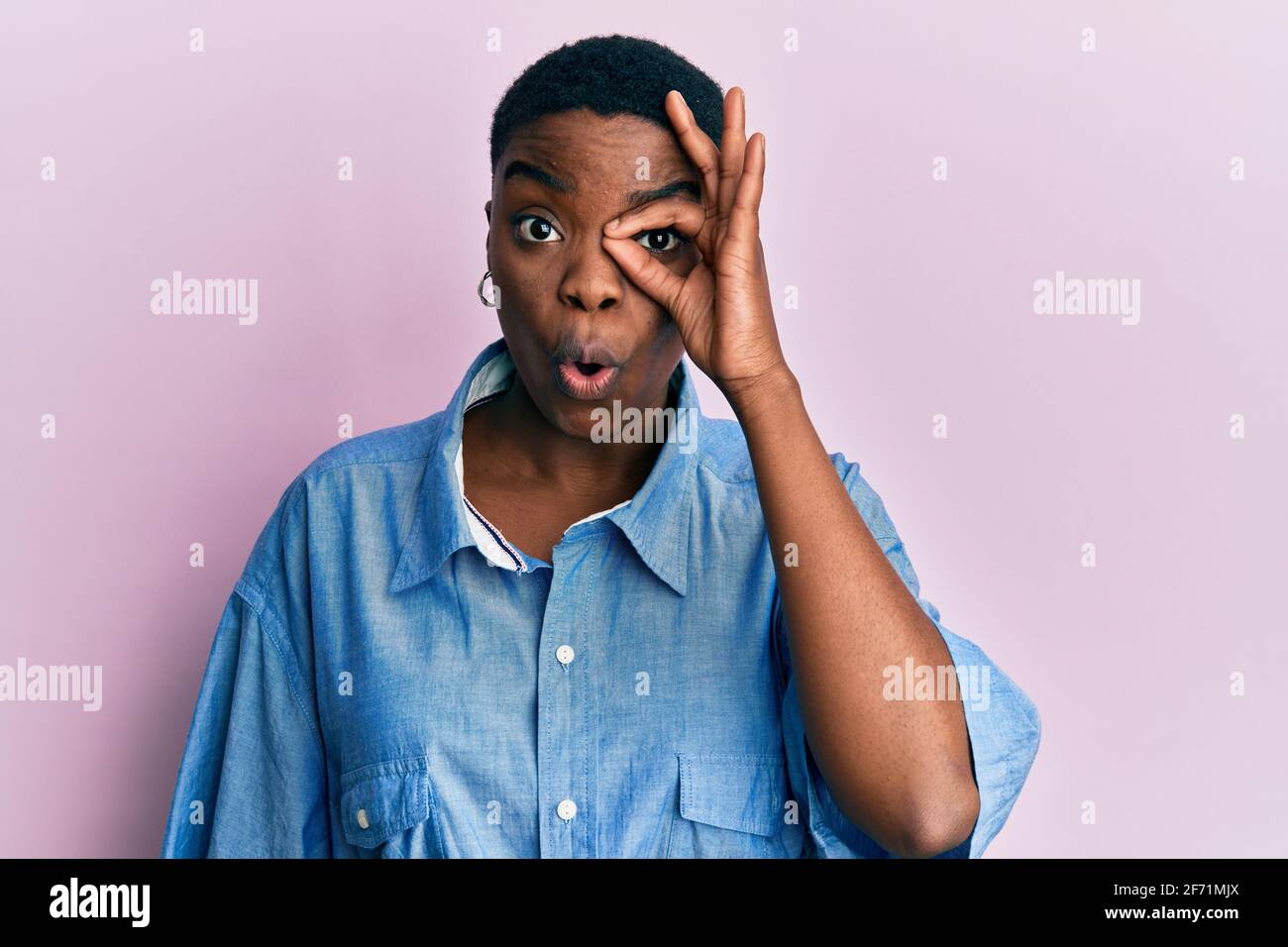 Young african american woman wearing casual clothes doing ok gesture ...