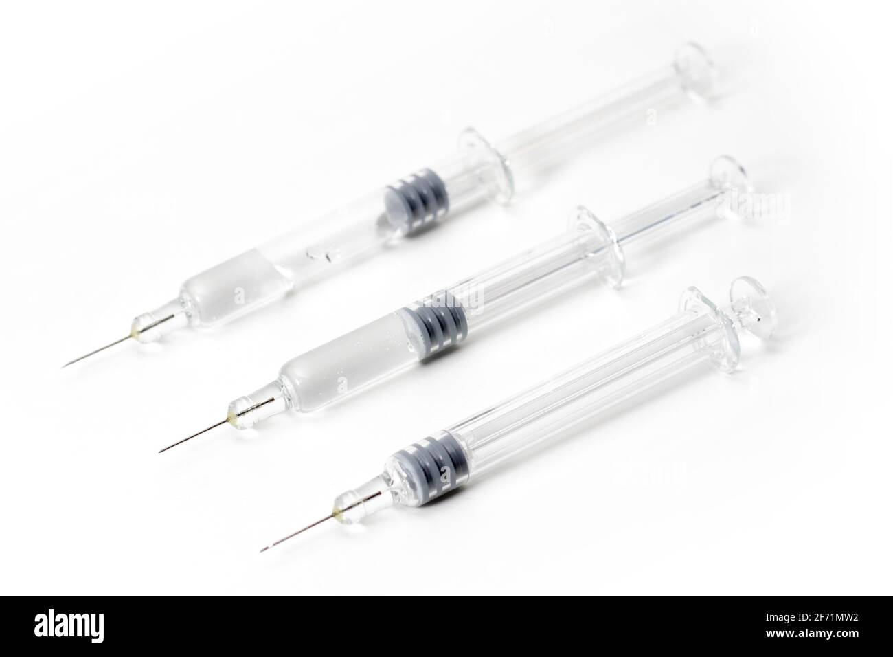 Syringes isolated on white background Stock Photo - Alamy