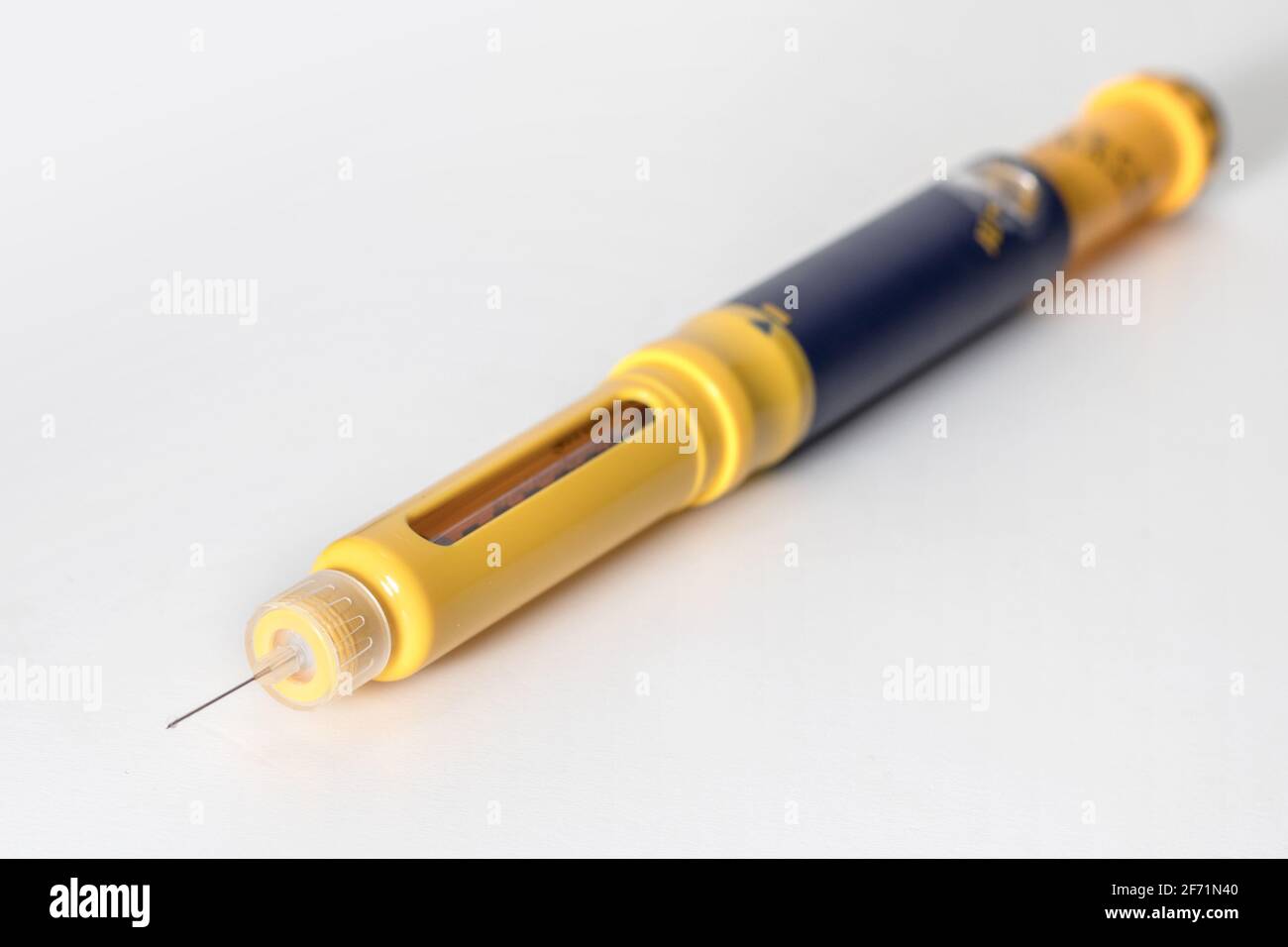 Insulin pen with insulin drop at needle tip isolated on white ...
