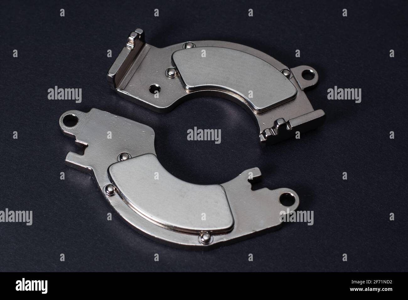 Hard disk drive magnet on black background Stock Photo - Alamy