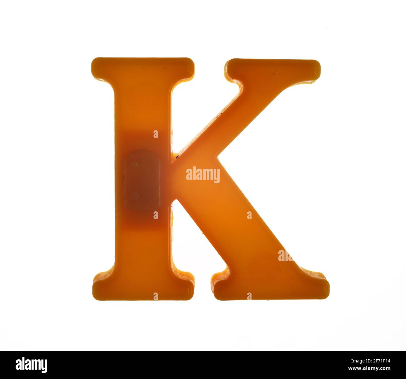 Plastic letter K on magnet isolated on white background, top view Stock ...