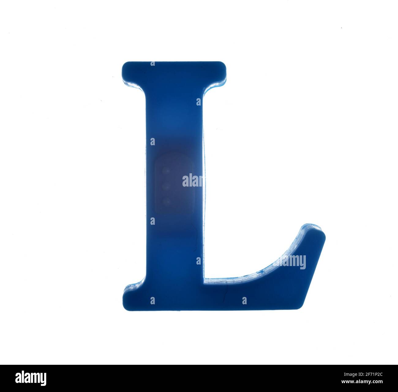 Plastic letter L on magnet isolated on white background, top view Stock ...