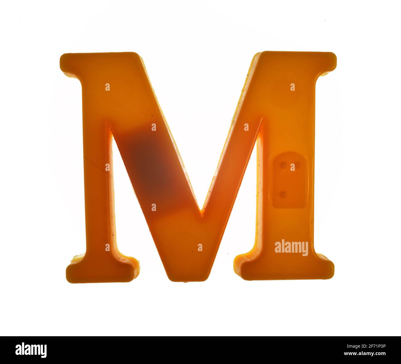 Plastic letter M on magnet isolated on white background, top view Stock ...