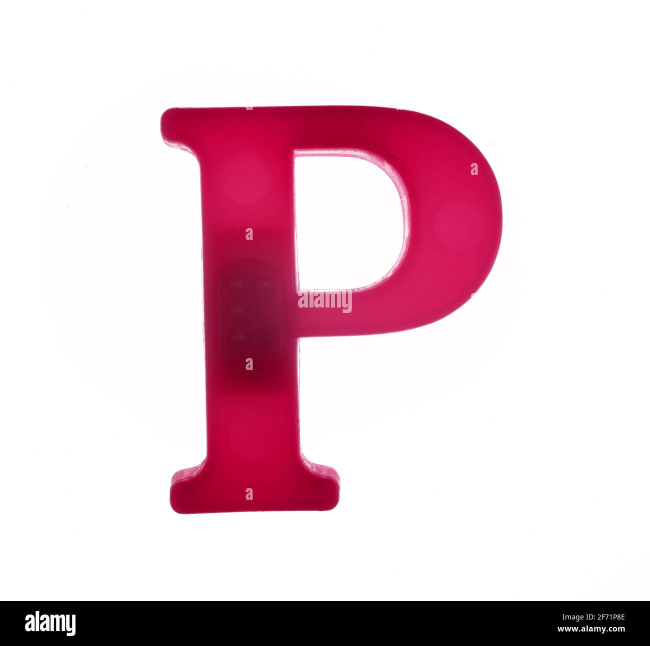 Plastic letter P on magnet isolated on white background, top view Stock ...