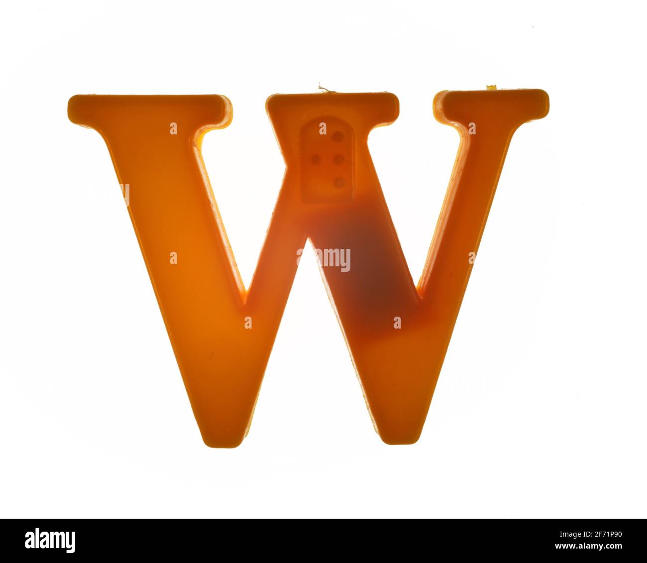 Plastic letter W on magnet isolated on white background, top view Stock ...