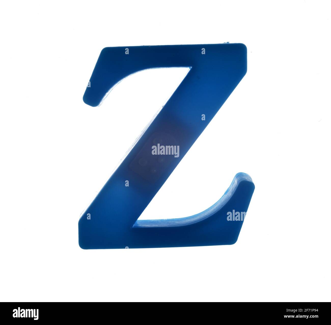 Plastic letter Z on magnet isolated on white background, top view Stock ...