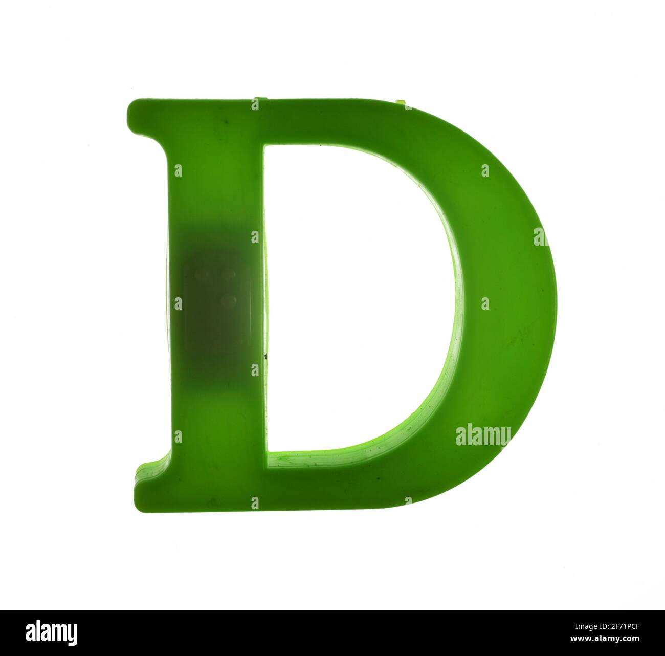 Plastic letter D on magnet isolated on white background, top view Stock ...