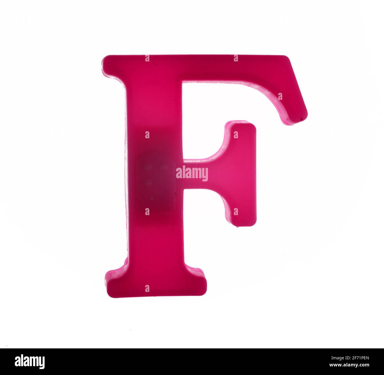 Plastic letter F on magnet isolated on white background, top view Stock ...