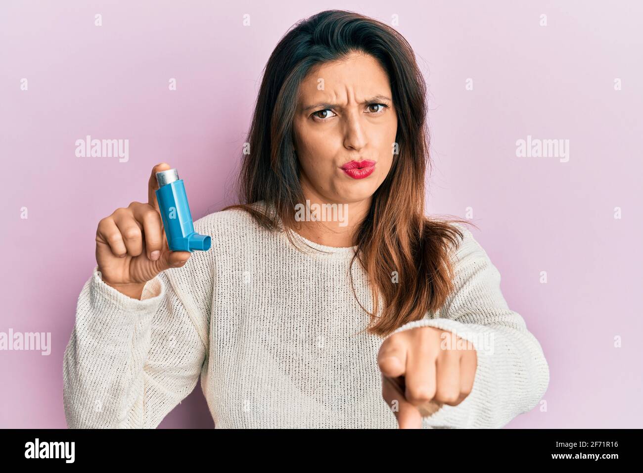 Hispanic female asthma inhaler hi-res stock photography and images - Alamy