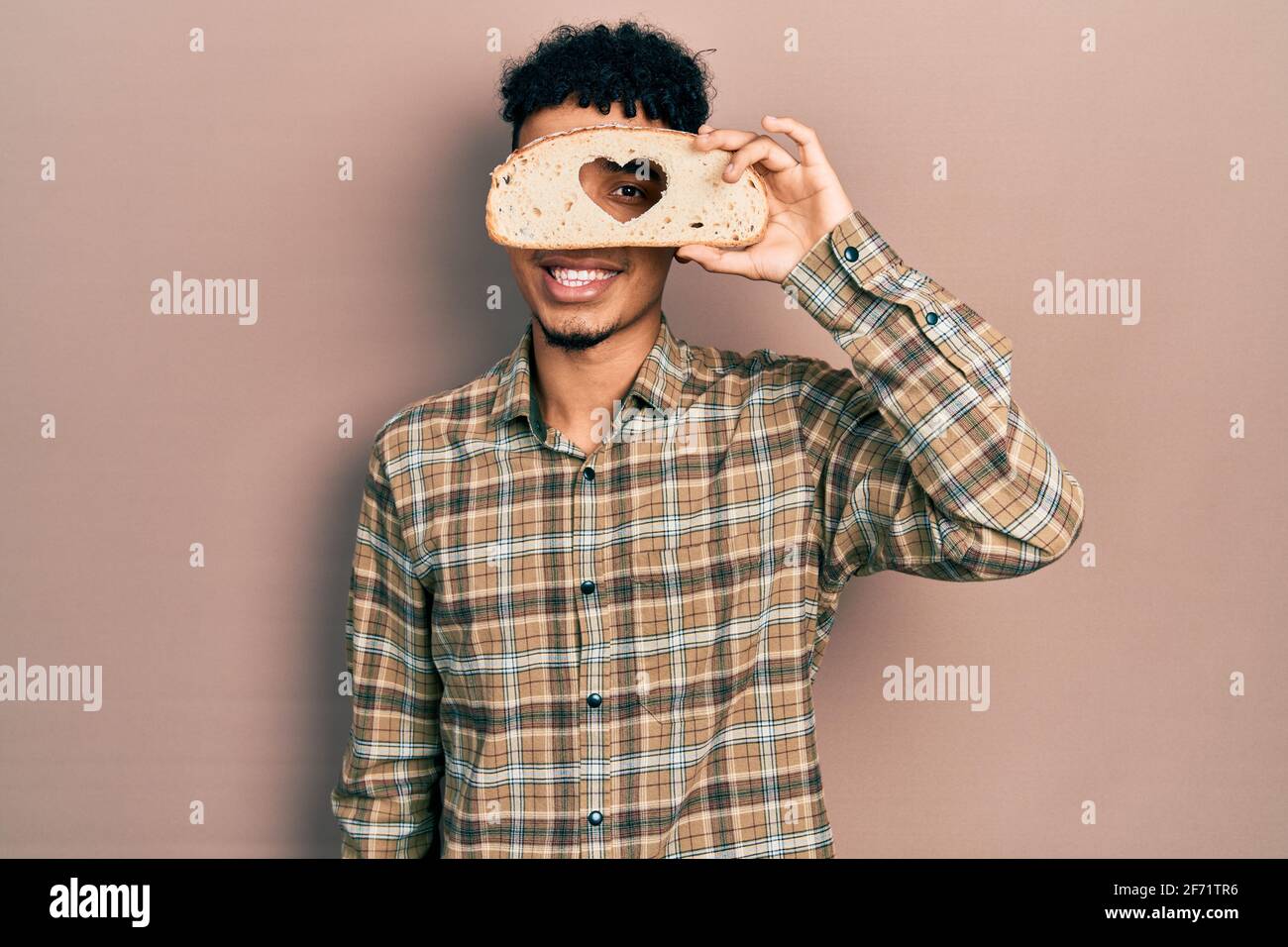 Black male with a loaf of bread hi-res stock photography and images - Alamy