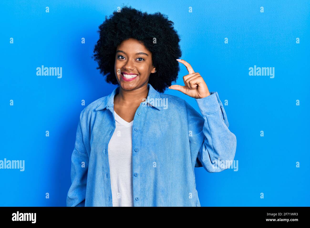 Young african american woman wearing casual clothes smiling and ...