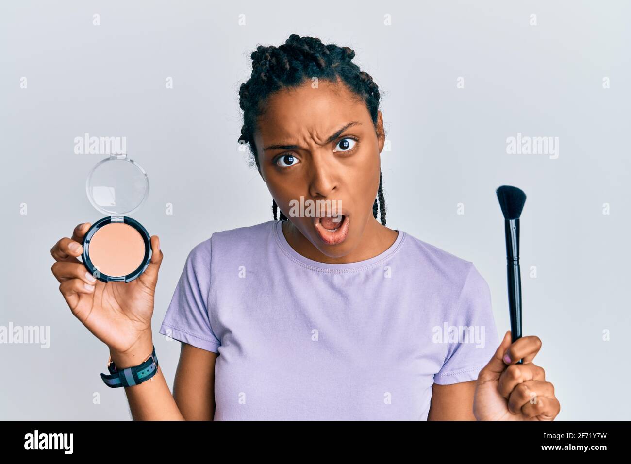 Woman makeup thinking brush hi-res stock photography and images - Alamy