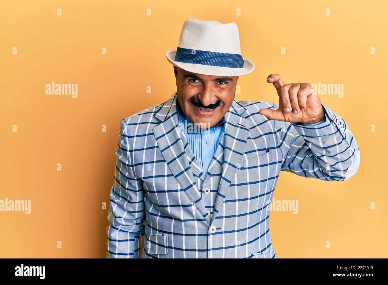 Mature middle east man with mustache wearing vintage and elegant ...