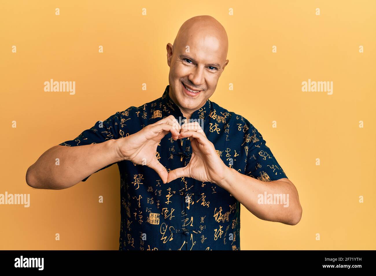 Middle age bald man wearing casual clothes smiling in love showing ...