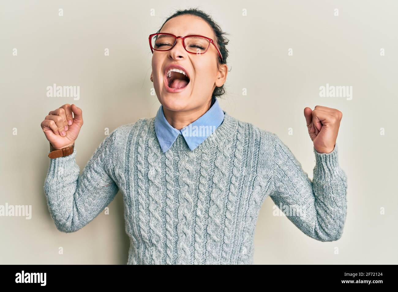 Young caucasian woman wearing casual clothes and glasses angry and mad ...