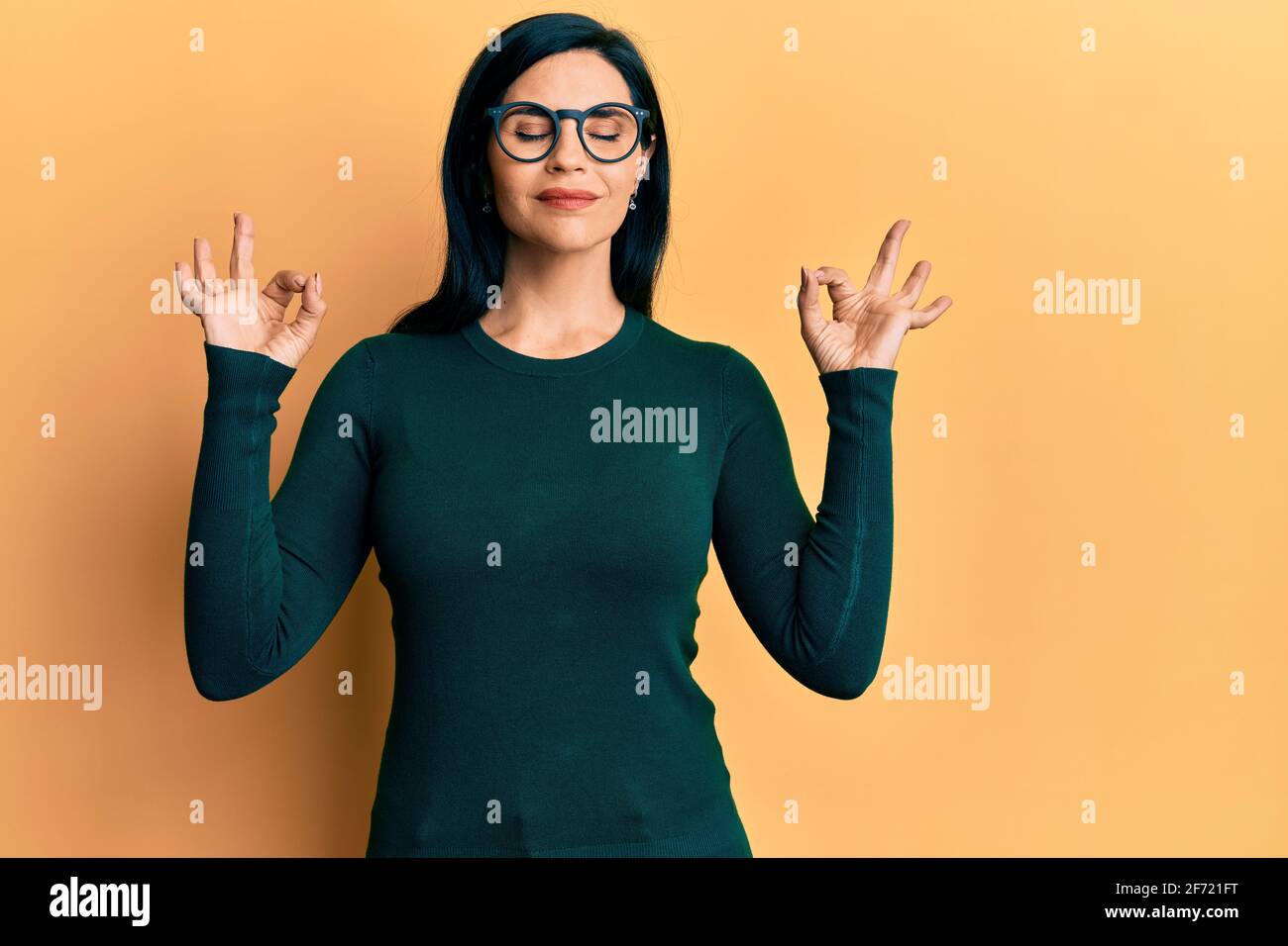 Young caucasian woman wearing casual clothes and glasses relax and ...