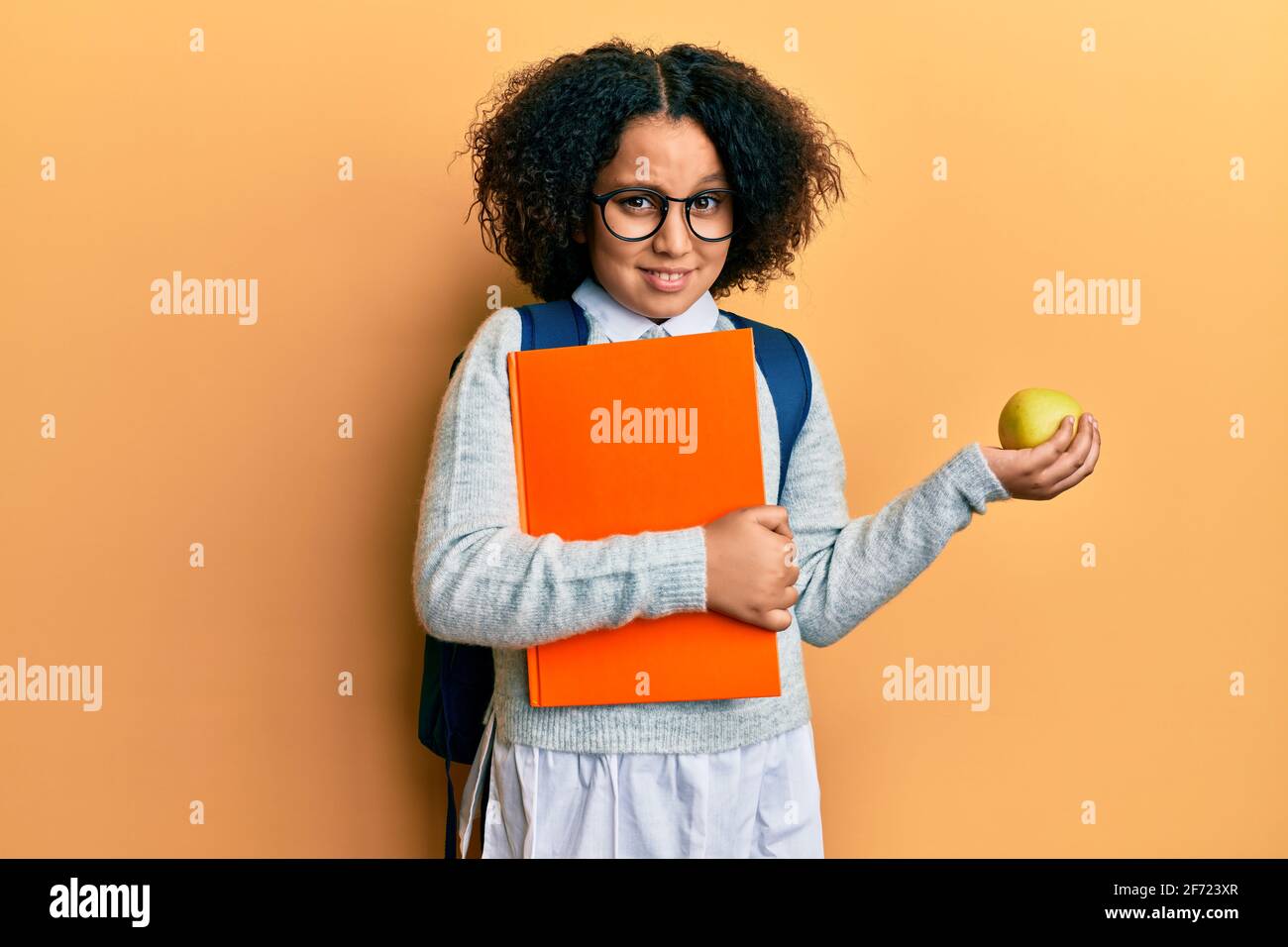 Confused kid with apple hi-res stock photography and images - Alamy