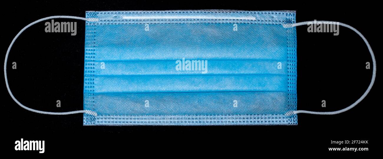 Surgical mask with rubber ear straps. Typical 3-ply surgical mask to ...