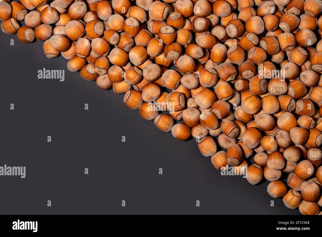Hazelnuts. Stack of hazelnuts. Food background. Hazelnut on darck ...