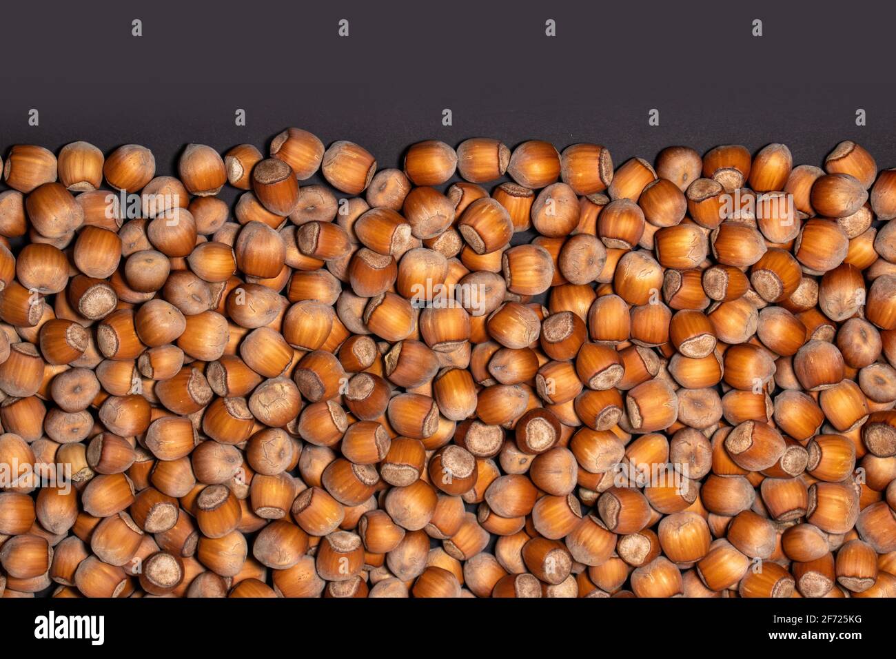 Hazelnuts. Stack of hazelnuts. Food background. Hazelnut on darck ...