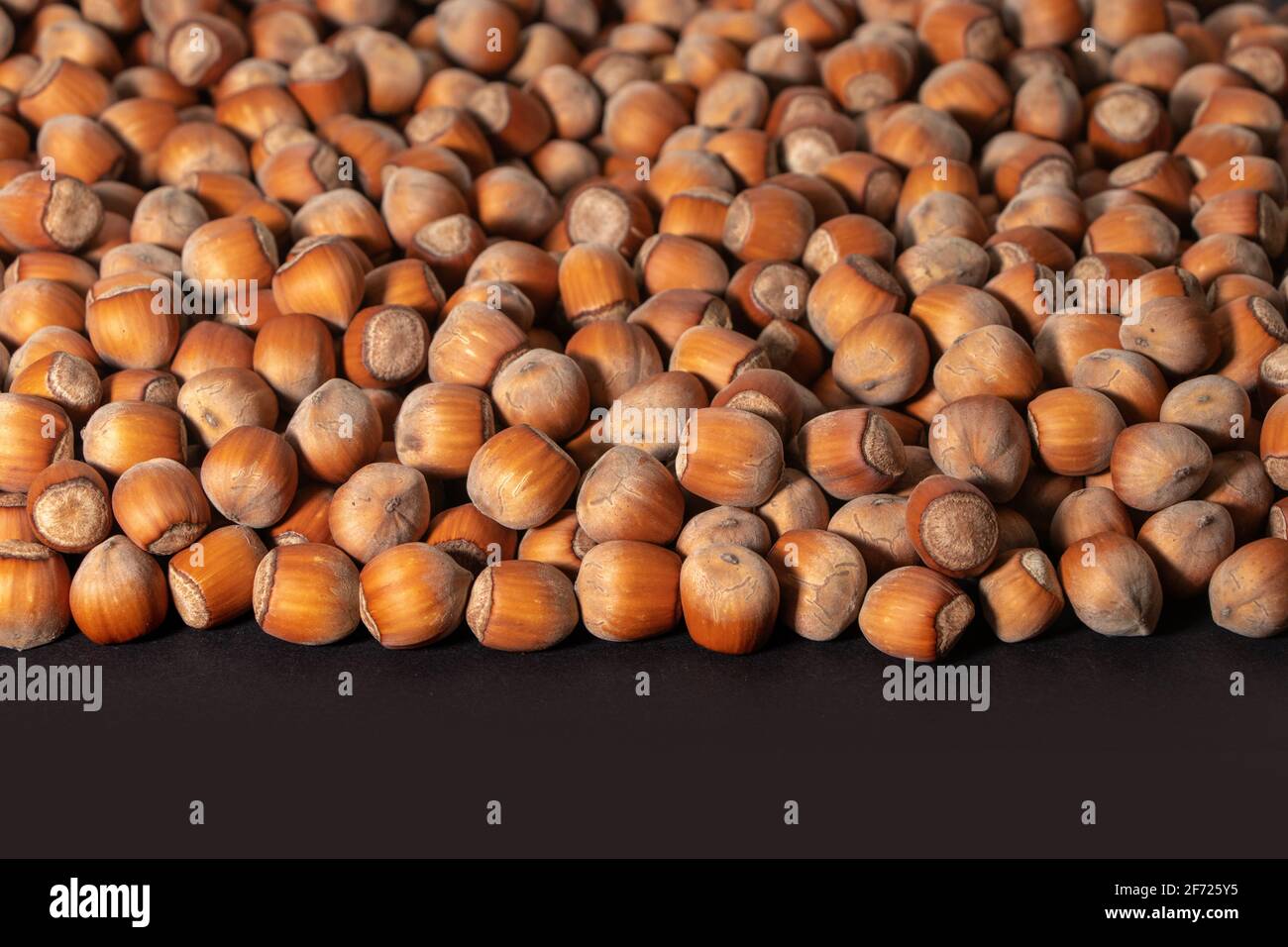 Hazelnuts. Stack of hazelnuts. Food background. Hazelnut on darck ...