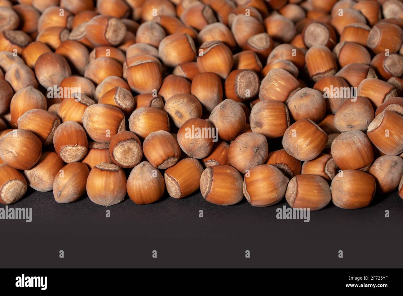 Hazelnuts. Stack of hazelnuts. Food background. Hazelnut on darck ...
