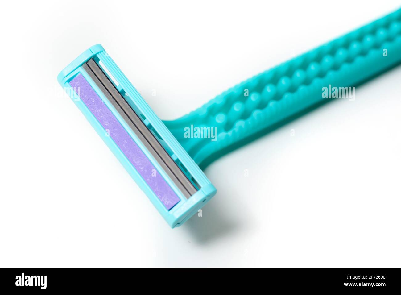 Cyan disposable razors isolated on white background Stock Photo - Alamy