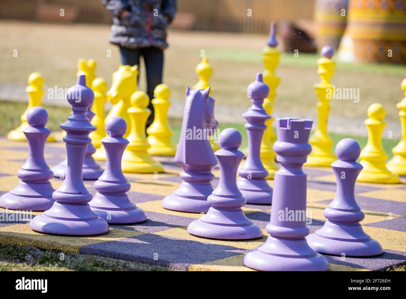 little girl playing big chess Stock Photo - Alamy